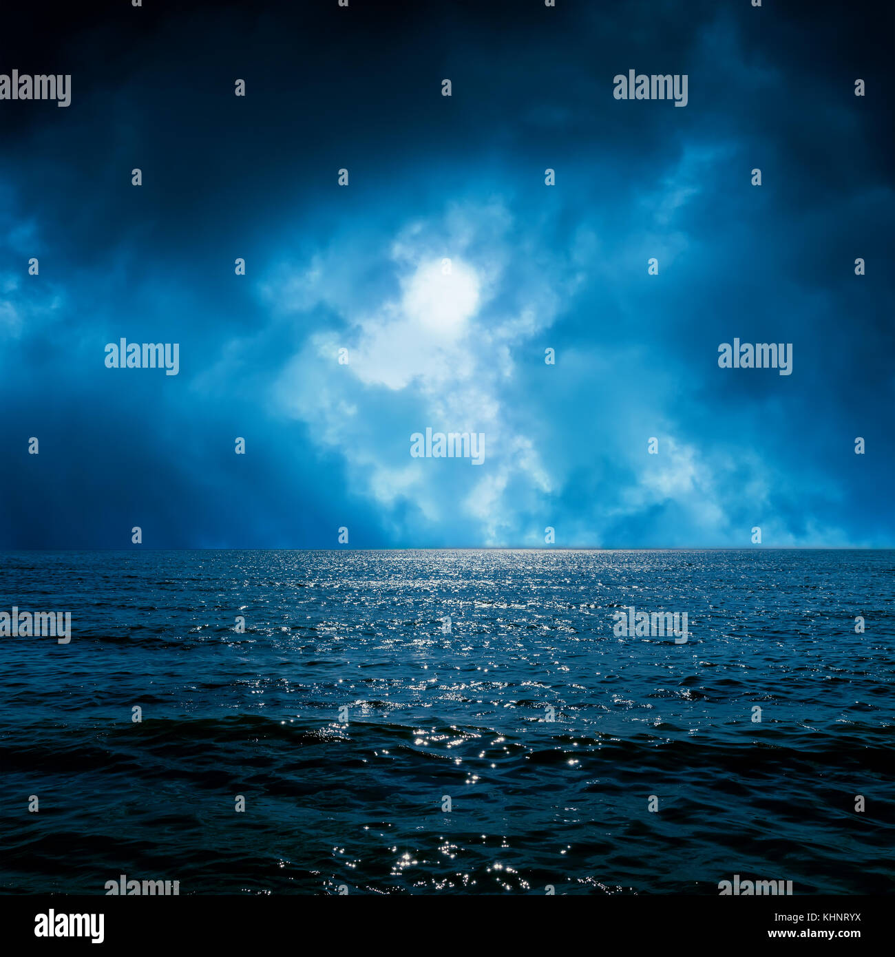 moon light in dramatic sky over dark sea Stock Photo - Alamy