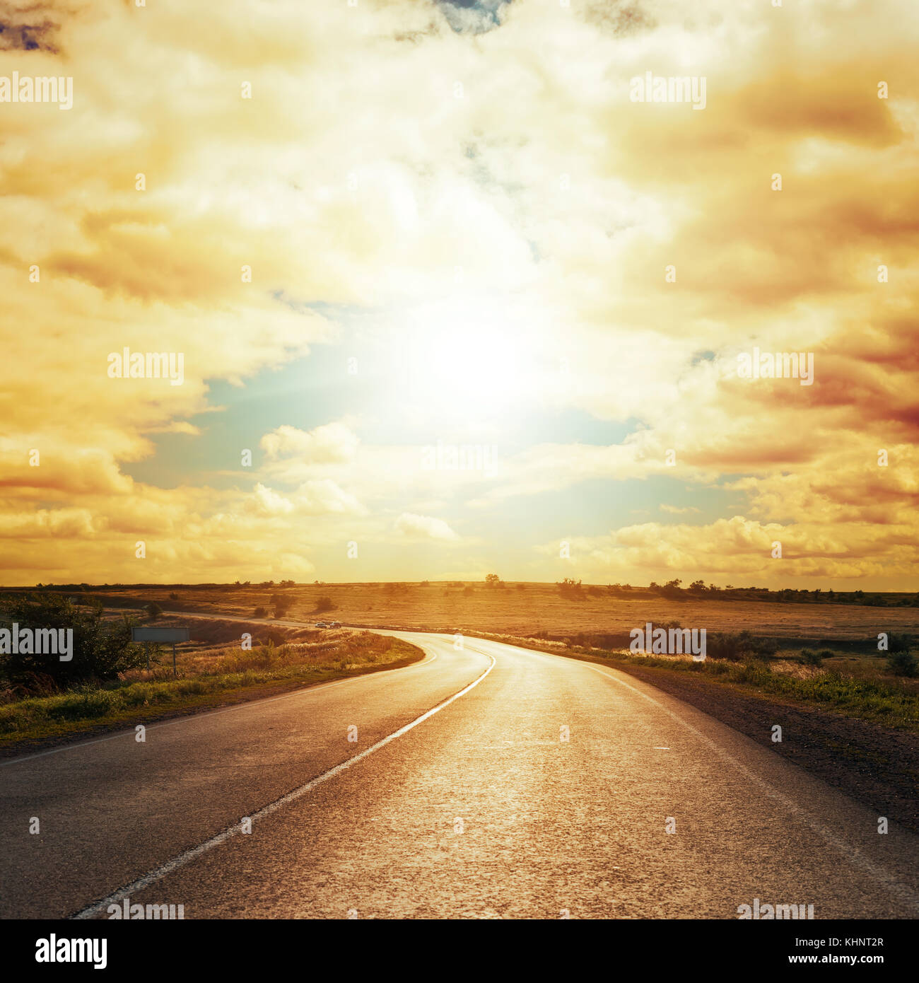 dramatic sunset in clouds over asphalt road Stock Photo - Alamy