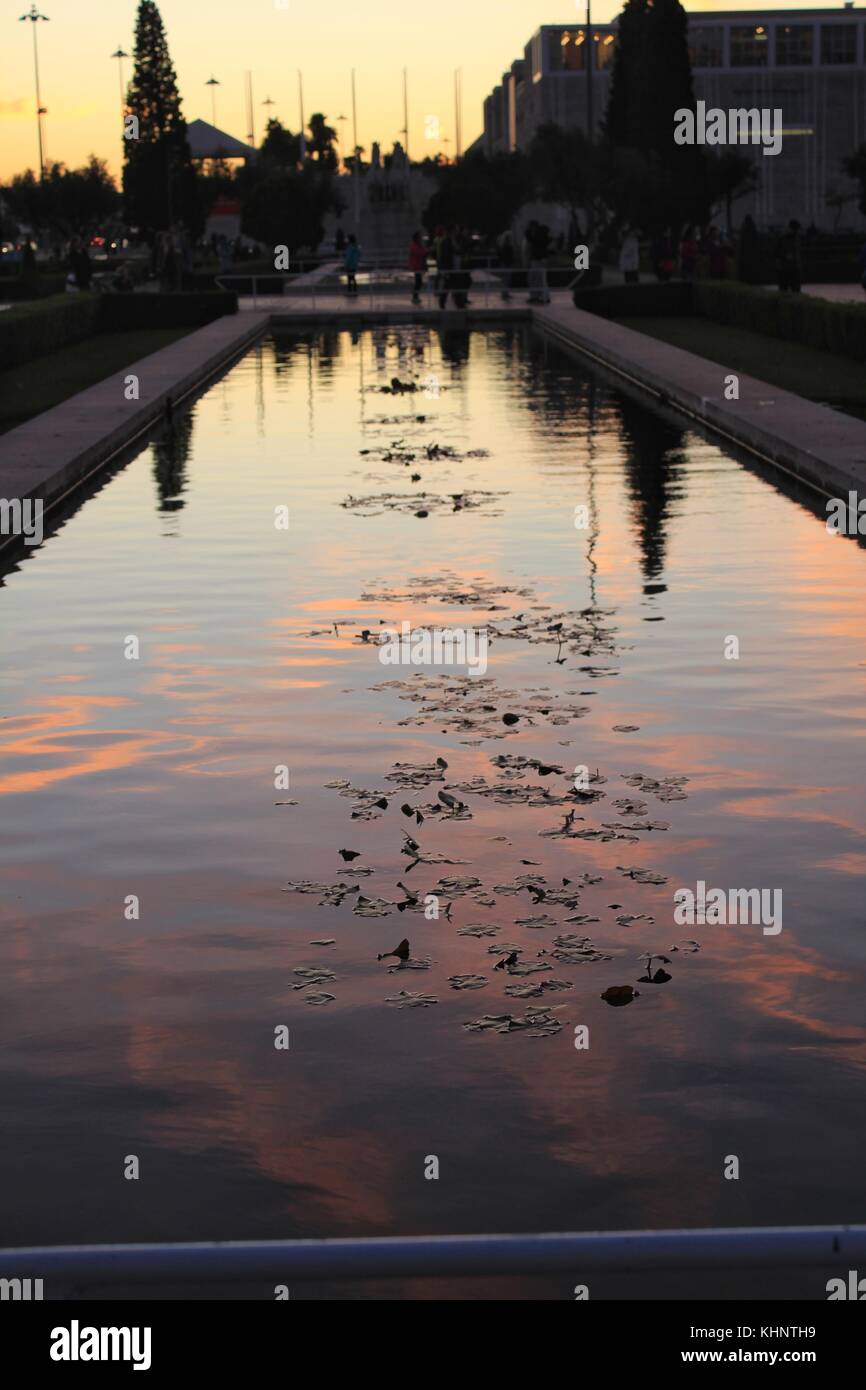 Fountain and reflections at sunset Stock Photo - Alamy