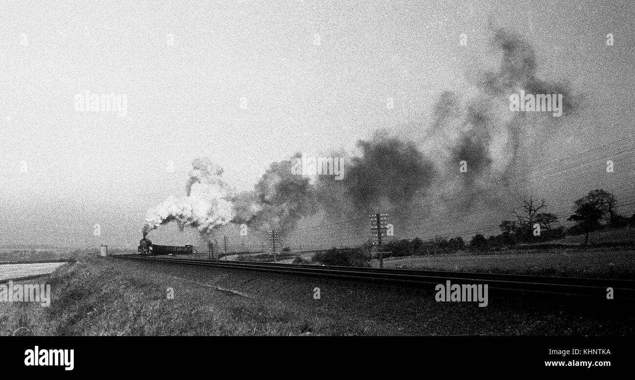 A dramatic scene as Railway Steam Locomotive train 61087 bellows steam ...