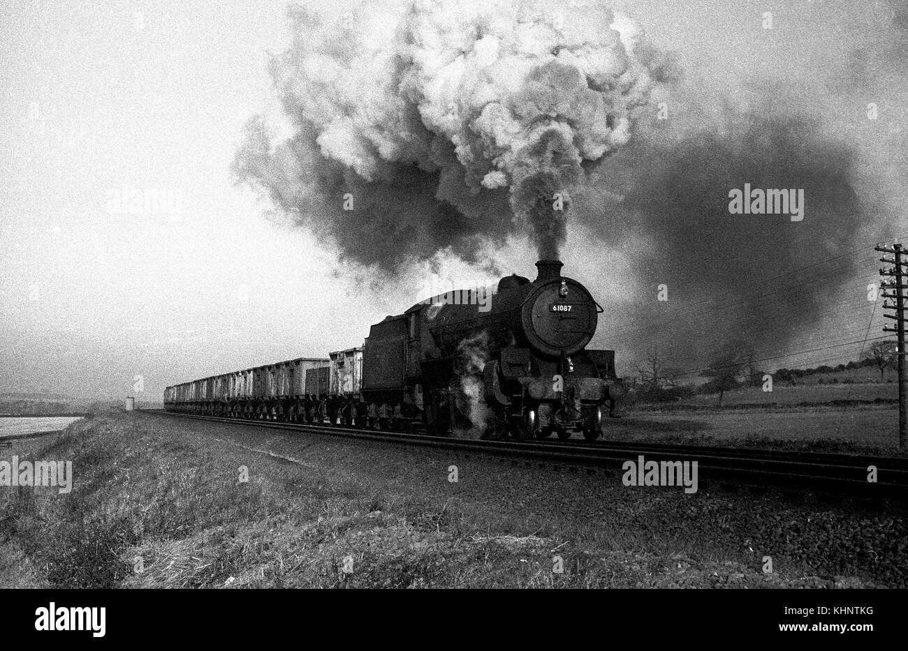 A dramatic scene as Railway Steam Locomotive train 61087 bellows steam ...
