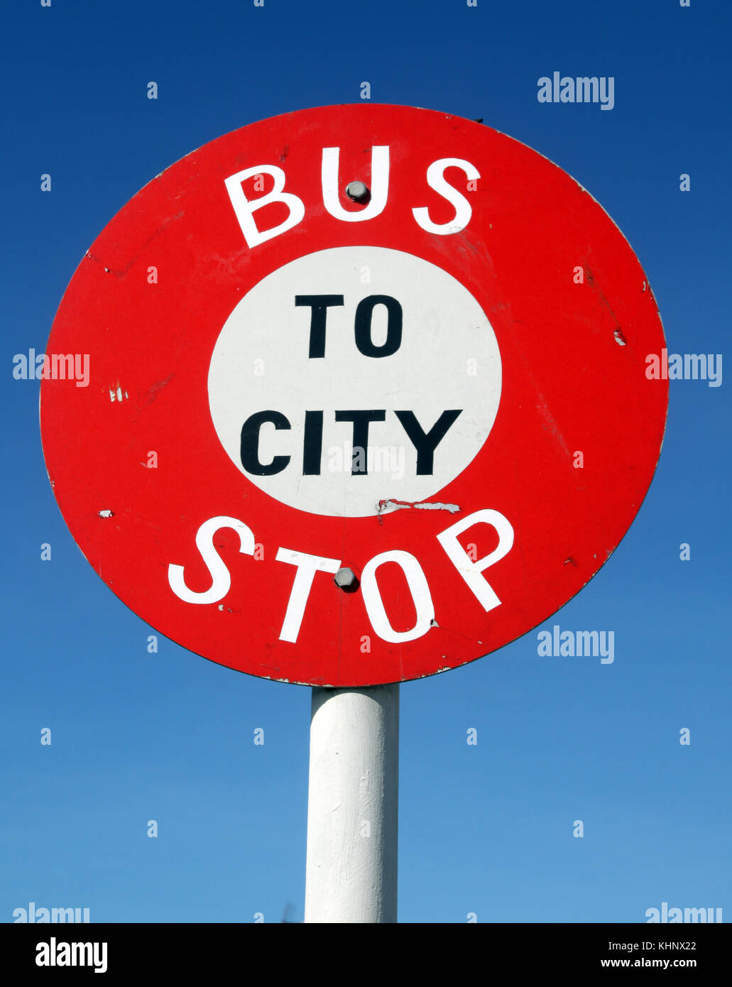 Red and white bus stop sign in Barbados Stock Photo - Alamy