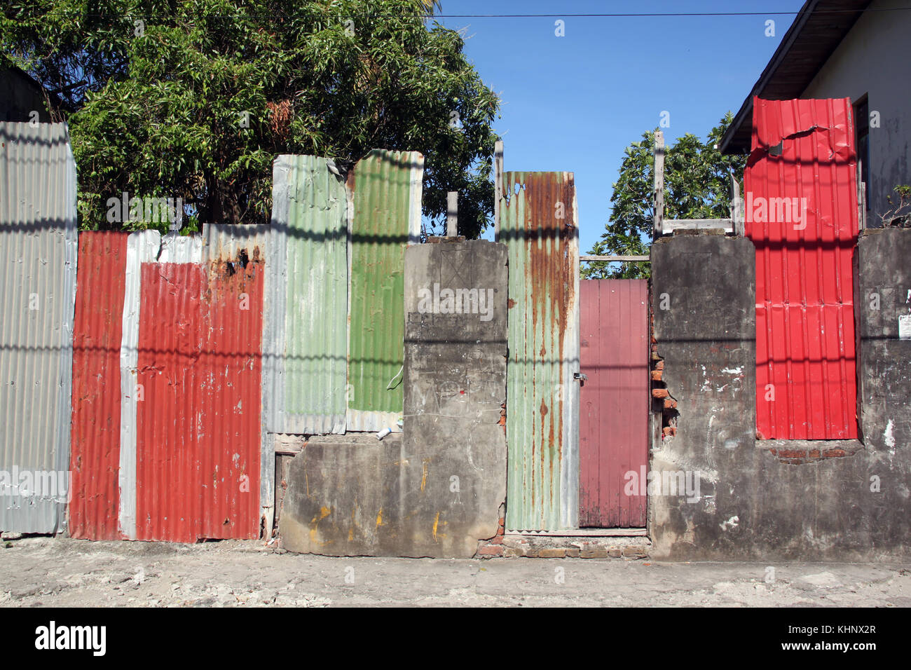 Wall on the street in town in caribean island Grenada Stock Photo - Alamy