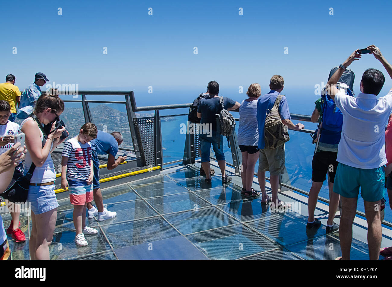 Tourists at the glass platform at the highest european cliff Cabo Girao ...
