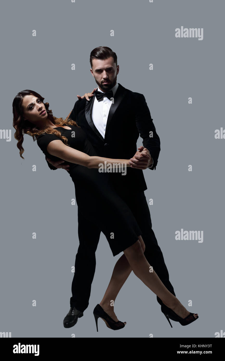 passion dancers over grey background Stock Photo - Alamy