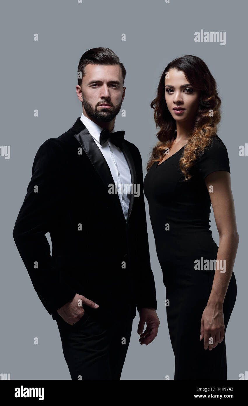 Business partners standing on a gray background Stock Photo - Alamy