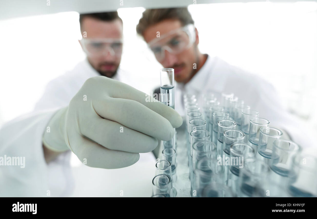 scientist and assistant studying the solution in the tube Stock Photo ...