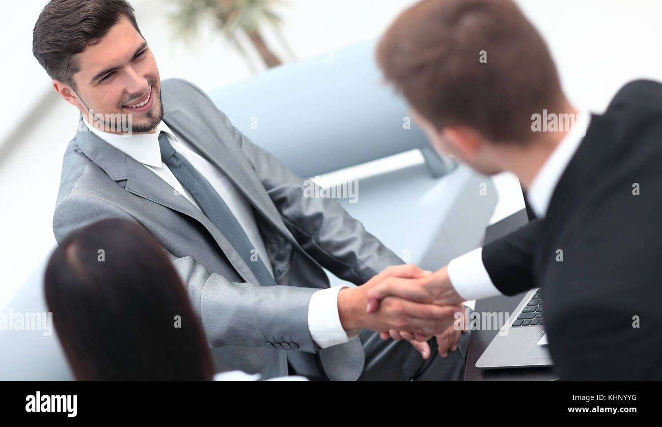 handshake business partners in the lobby of the office Stock Photo - Alamy