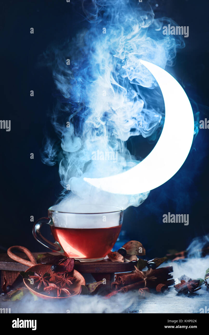 Cup of tea with dense steam and Moon crescent in conceptual astronomy ...