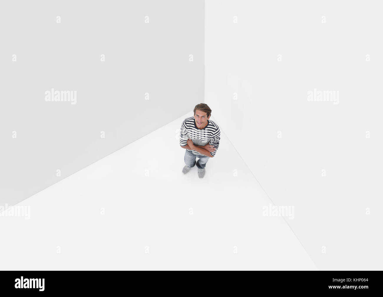 handsome guy standing near the white wall Stock Photo - Alamy