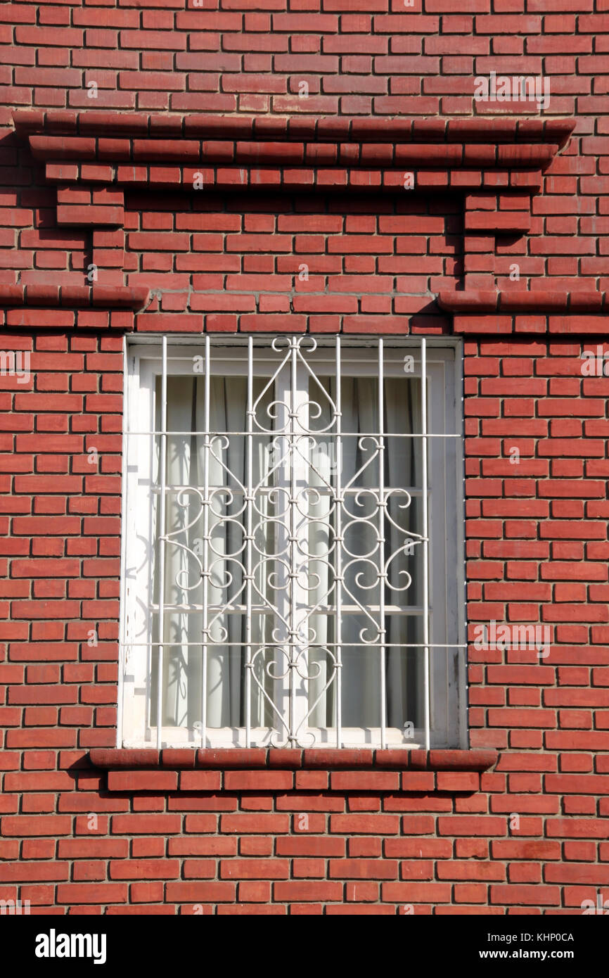 Red brick wall and white window in Trujillo, north Peru Stock Photo - Alamy