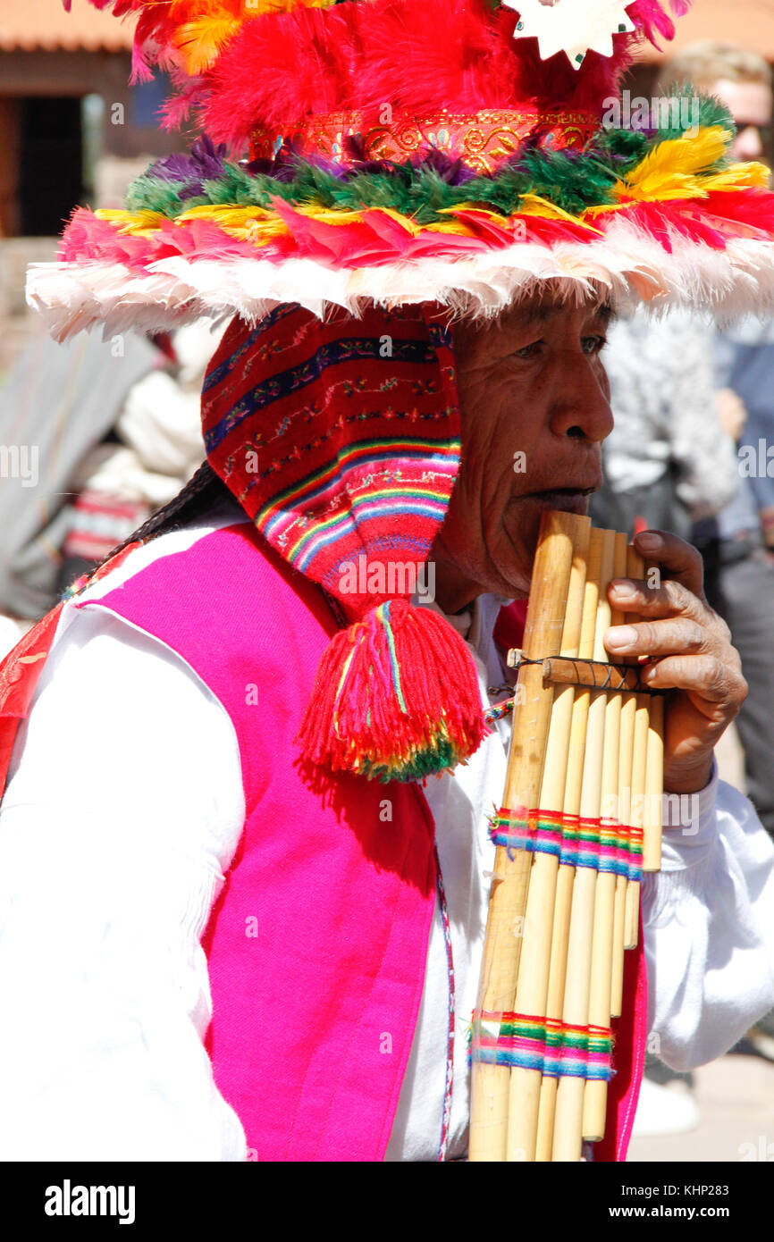 Men in traditional dress playing pan pipes at local Festival, Taquile ...