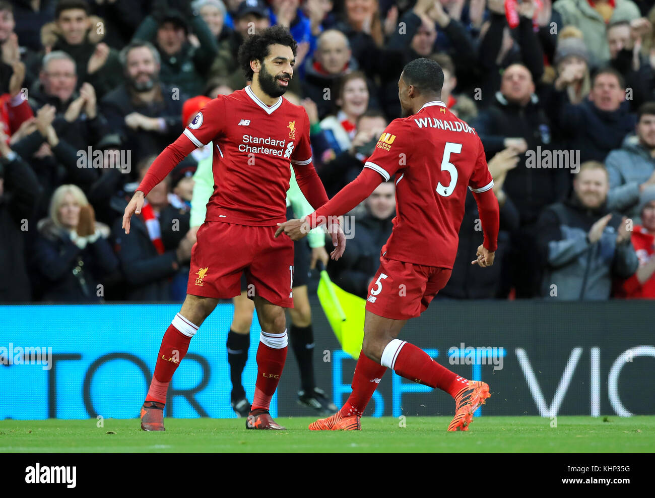Liverpool's Mohamed Salah celebrates scoring his side's first goal of ...