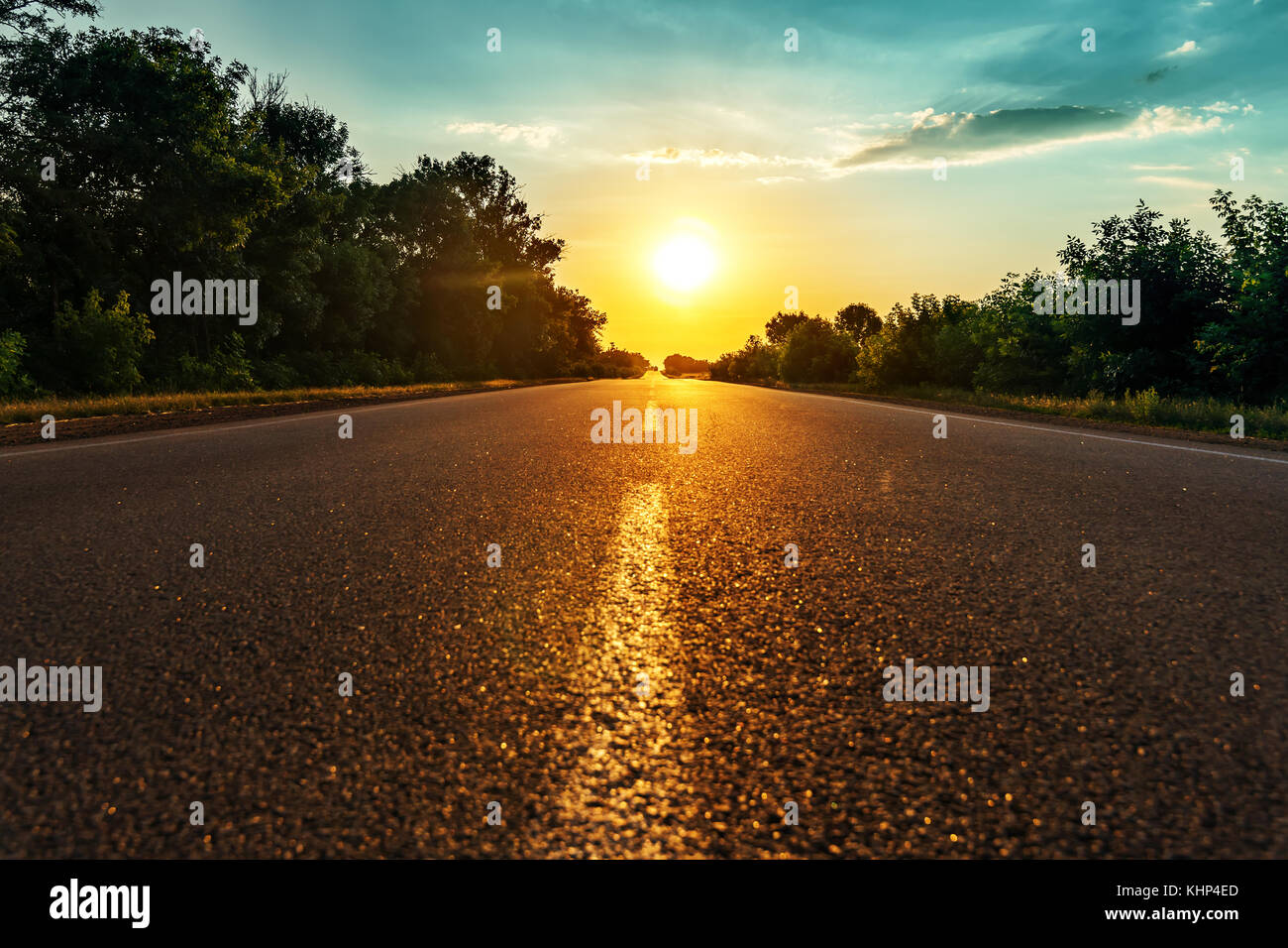 sun over asphalt road Stock Photo - Alamy