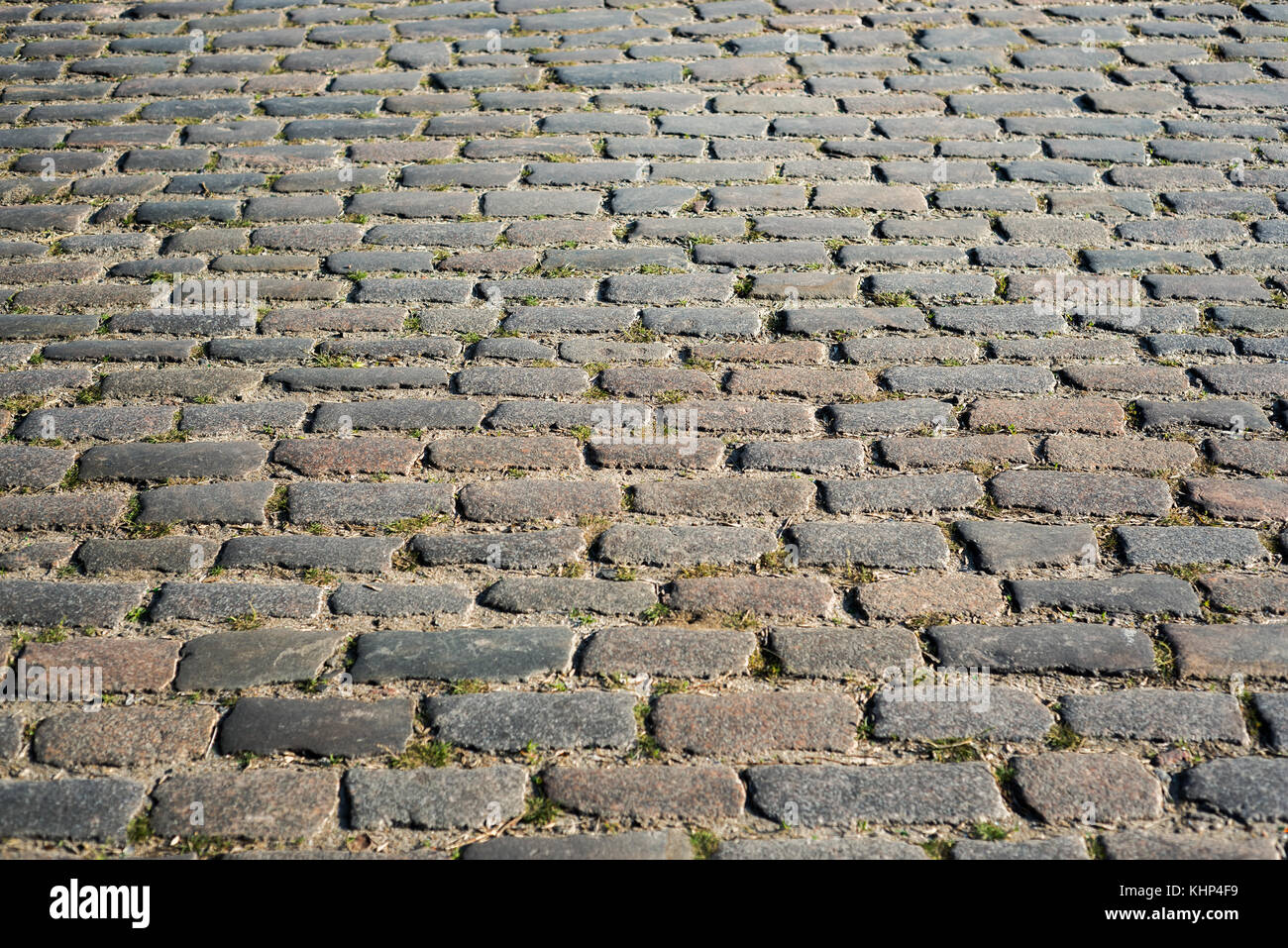 cobblestone road closeup as background Stock Photo - Alamy