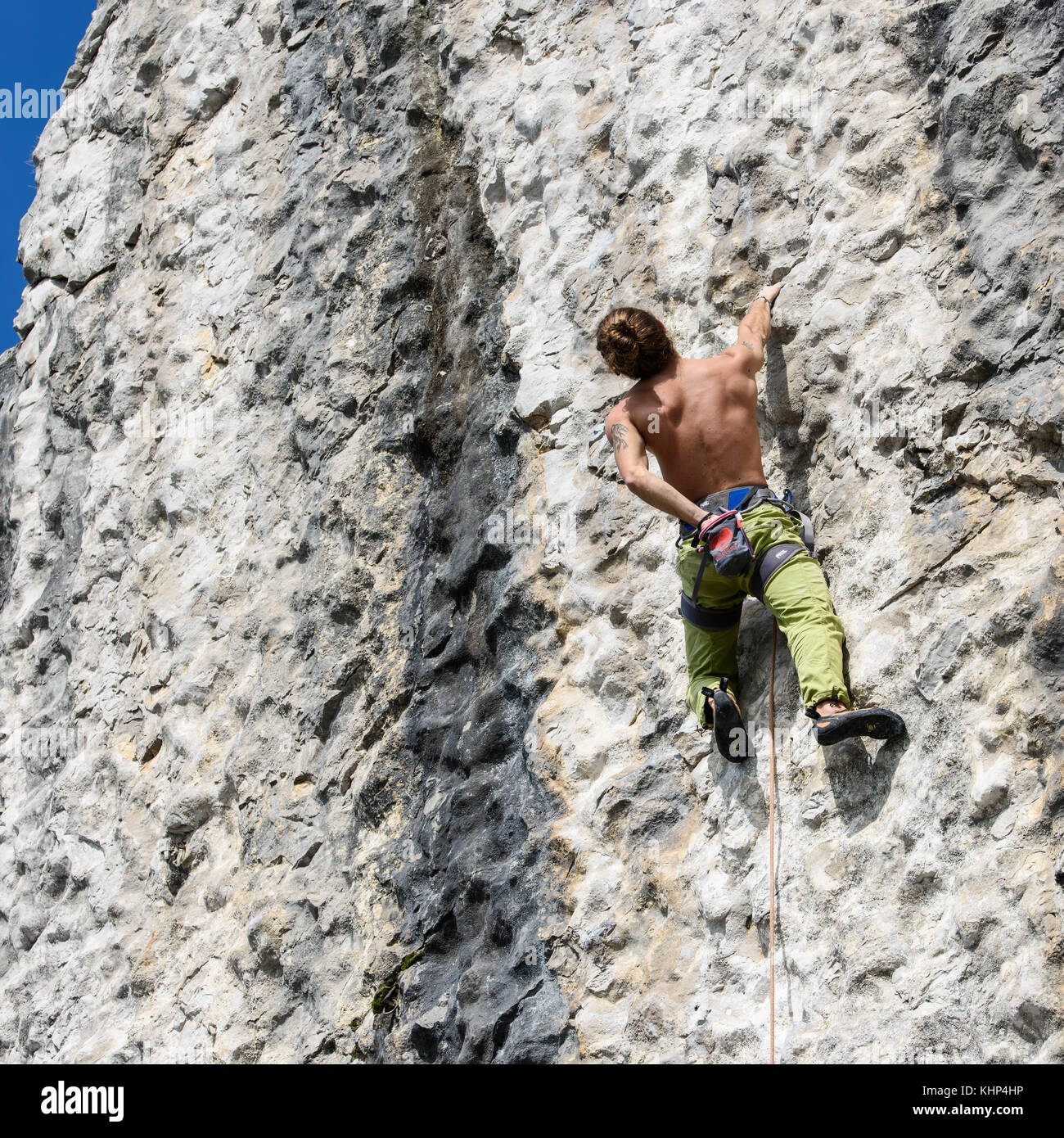 Climbing on the karst crag Stock Photo - Alamy