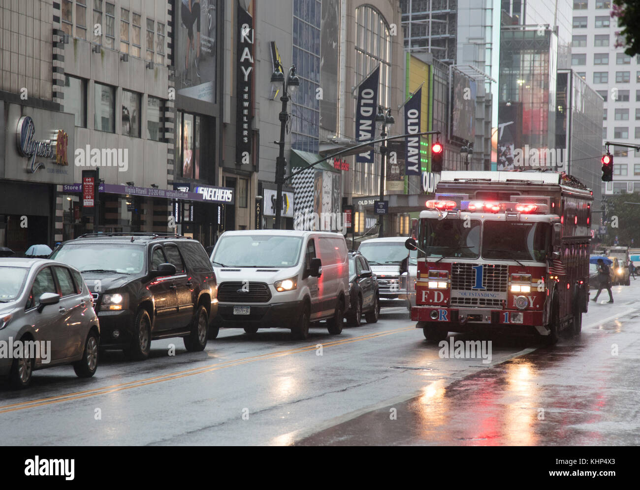 Fire Engine and Traffic in Rain in Midtown Manhattan New York Stock ...