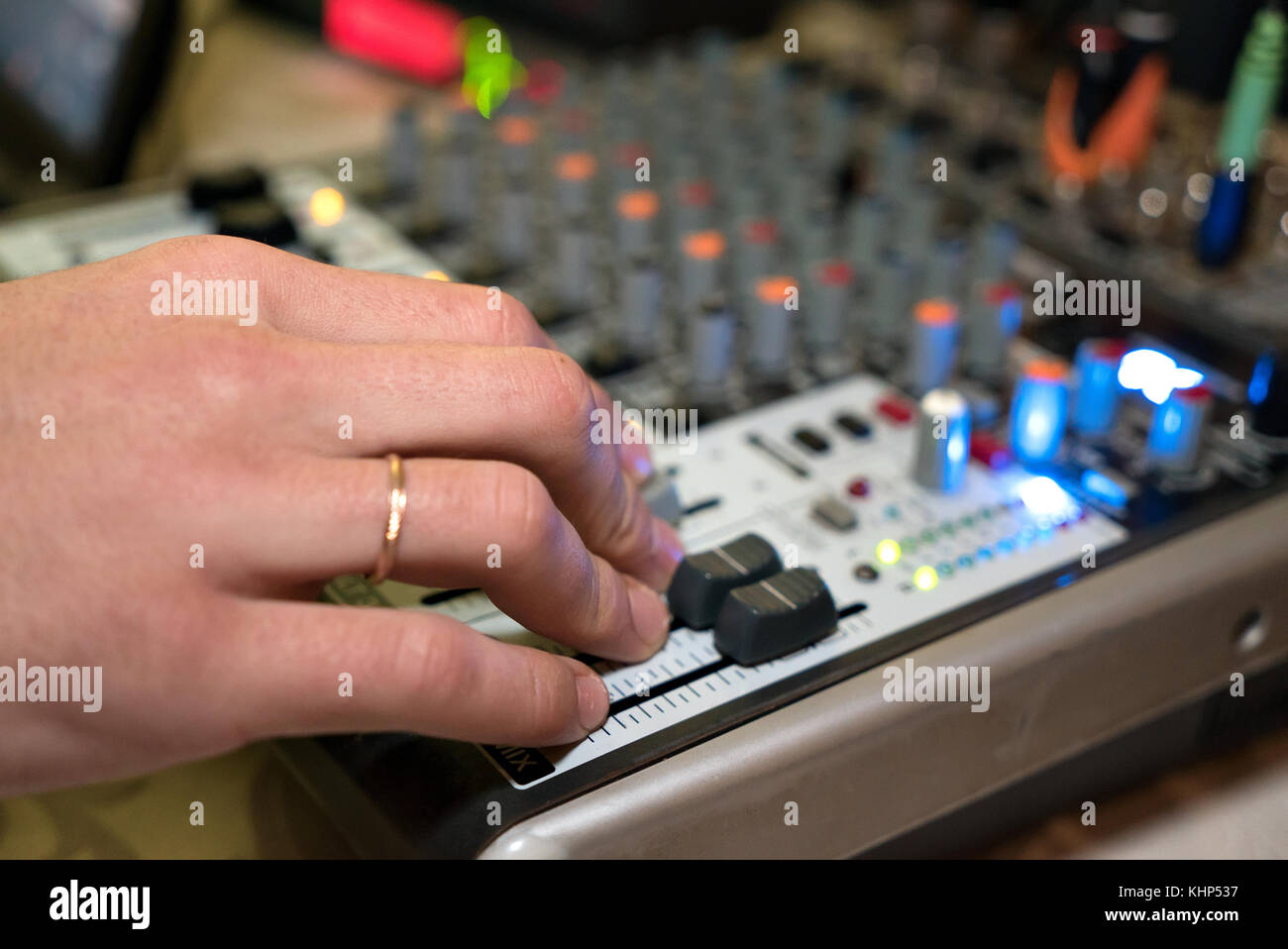 DJ working on a audiomixer at a nightclub Stock Photo - Alamy