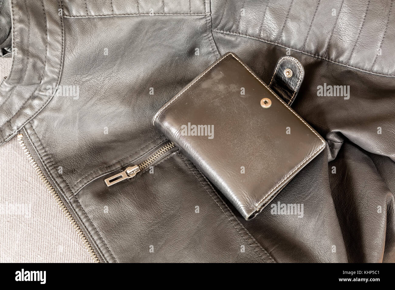 Stylish black leather jacket and a wallet on the floor Stock Photo - Alamy