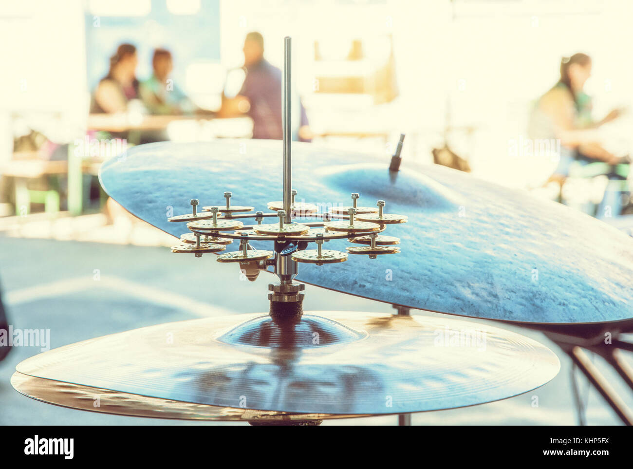 Detail of drums and cymbals. Concert scene with people. Yellow photo ...