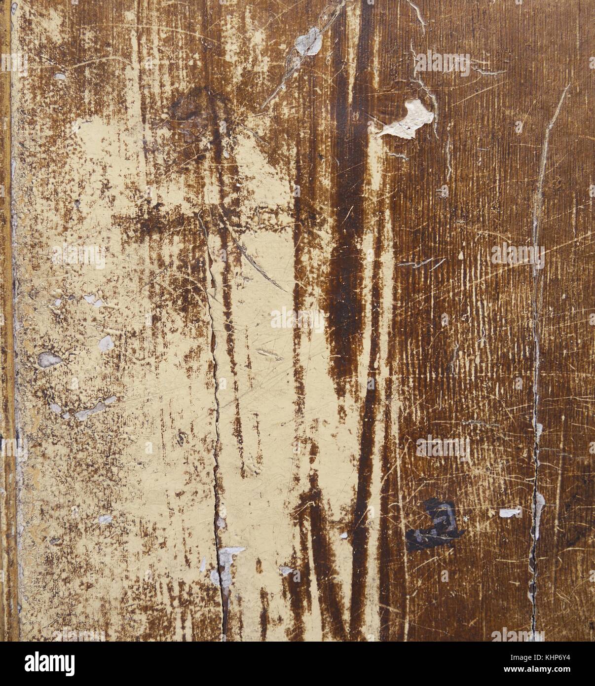 Textured, scratched background/backdrop of dark brown and cream wall ...