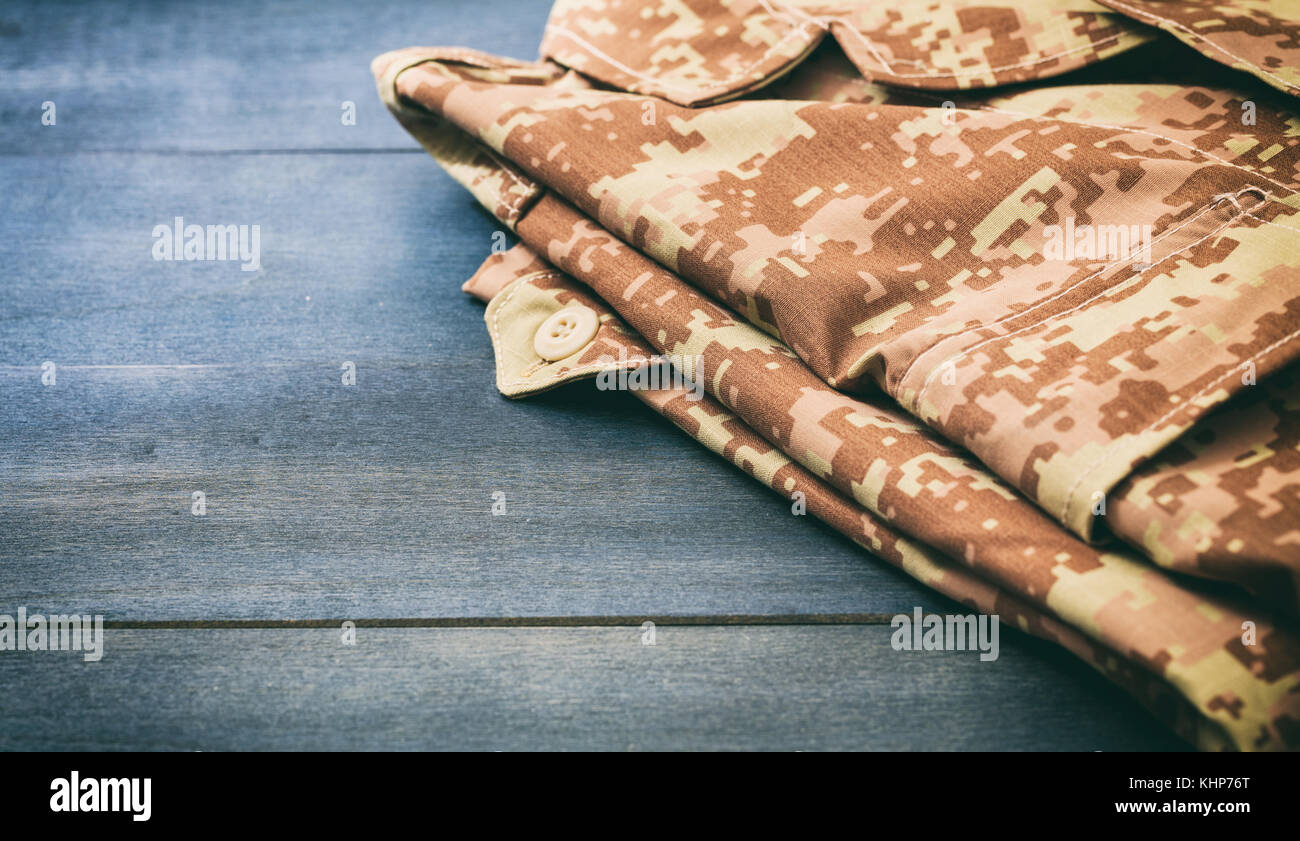 American military digital pattern uniform, folded on wooden background ...