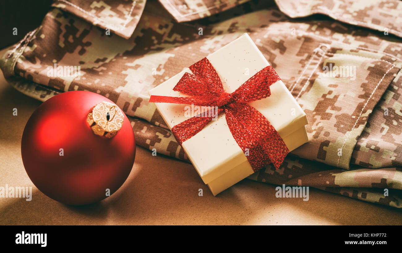 Christmas in the army concept. Christmas ball and gift box on an ...