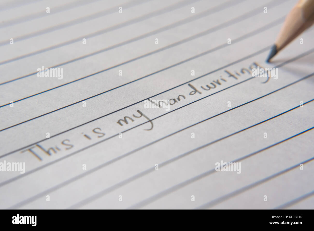 handwriting using pencil on a paper.write "this is my handwriting Stock ...