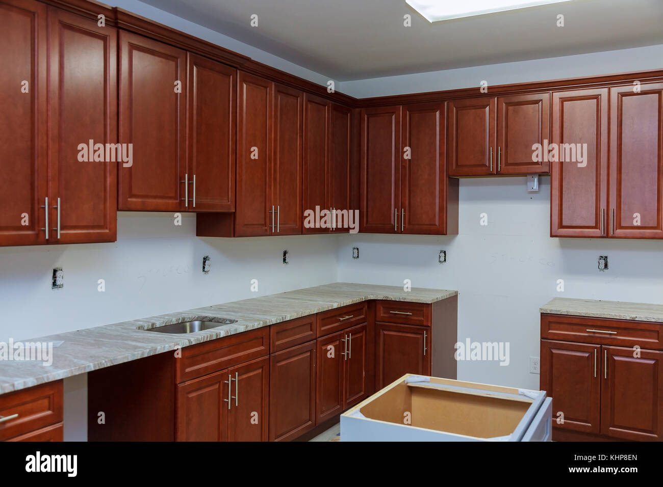 Installing new induction hob in modern nice kitchen Stock Photo - Alamy