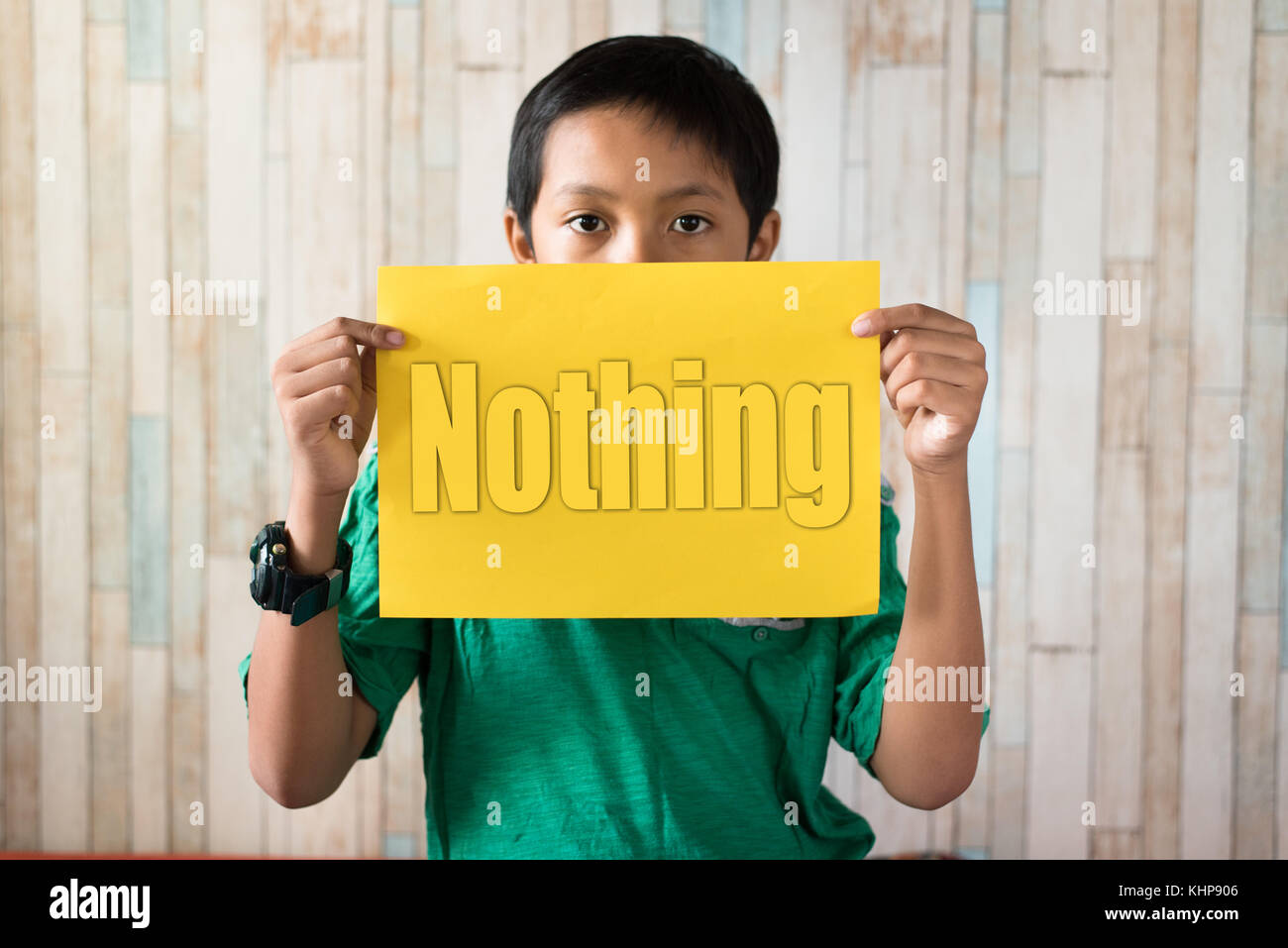asian boy holding paper note written "nothing" word.nothing word on ...