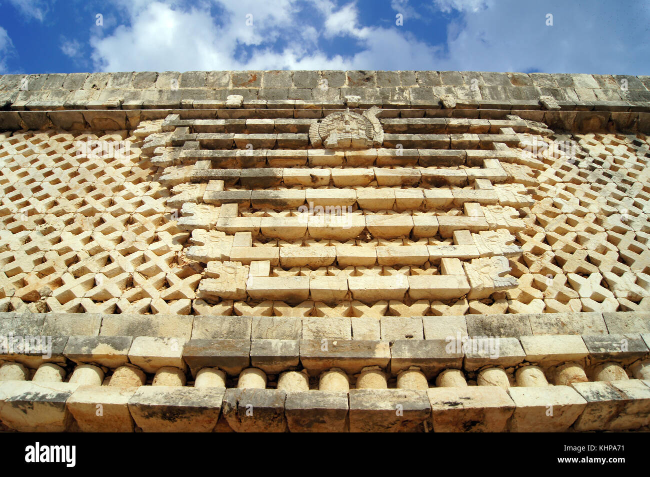 Wall of stone temple in Uxmal, Mexico Stock Photo - Alamy