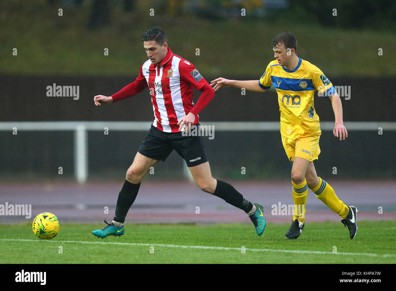 Jed Chouman of Hornchurch and Daniel Palmer of Hertford during AFC ...