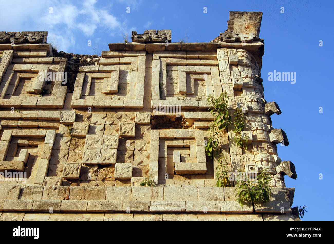 Corner of palace with mayan god Chak in Uxmal, Mexico Stock Photo - Alamy