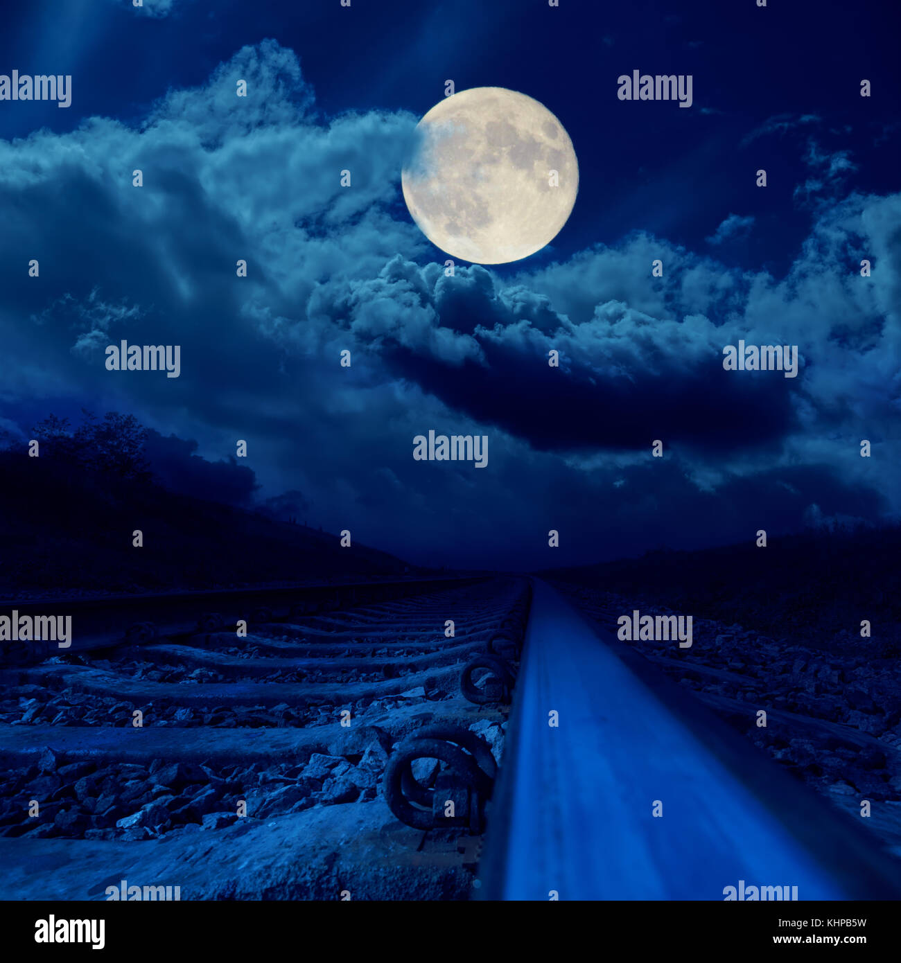 railroad closeup in night under full moon in clouds Stock Photo - Alamy