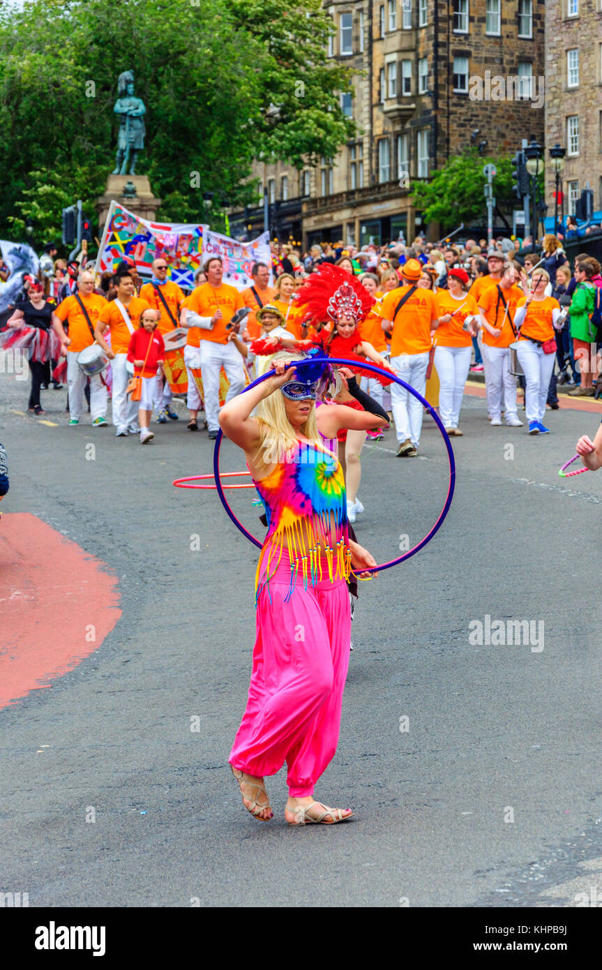 Female member of The Hula Honeys wearing a mask & performing in the ...