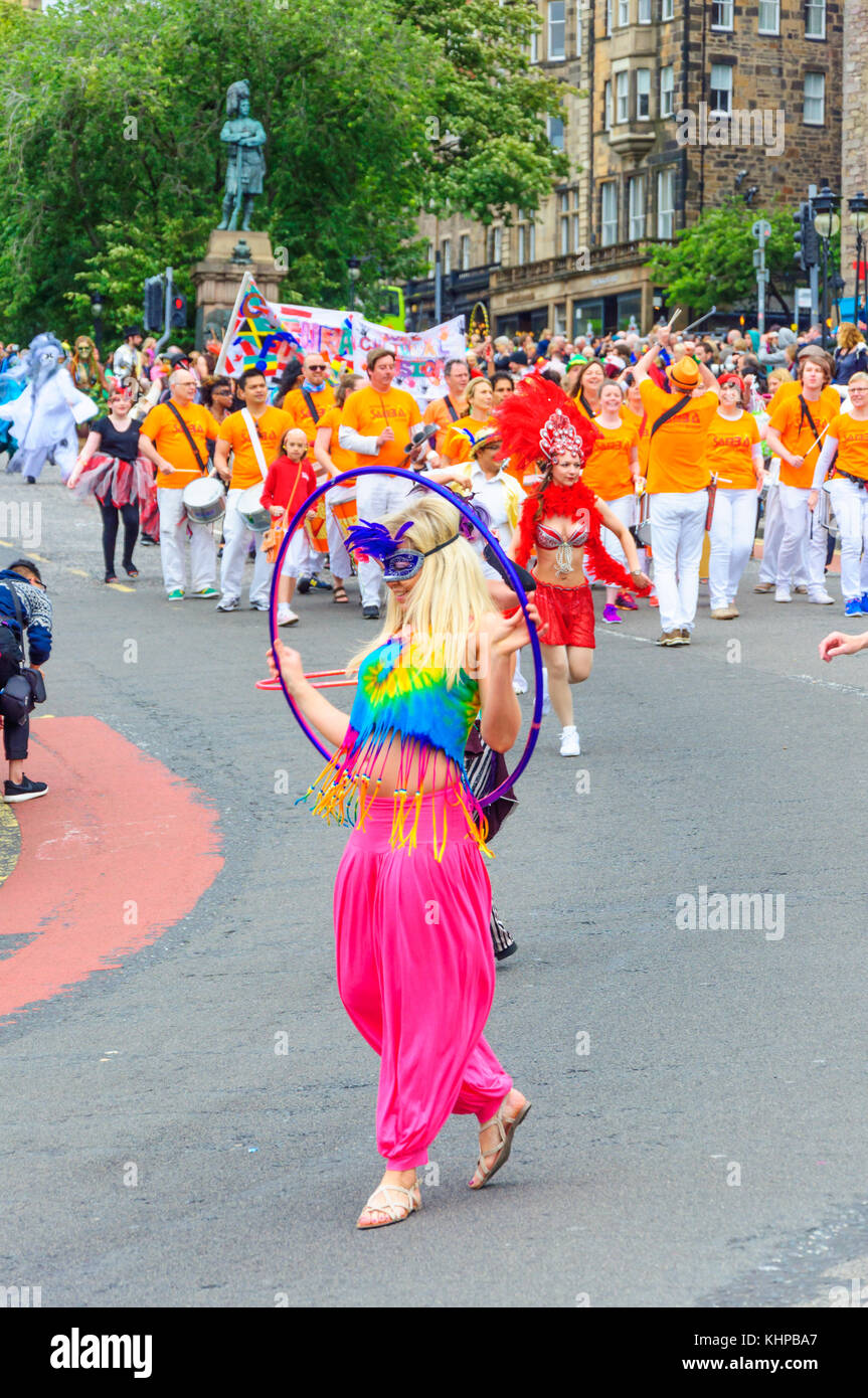 Female member of The Hula Honeys wearing a mask & performing in the ...
