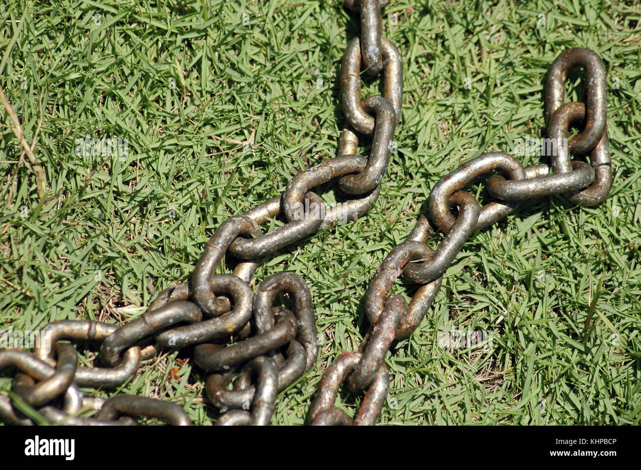 Chains on Green Lawn Stock Photo - Alamy