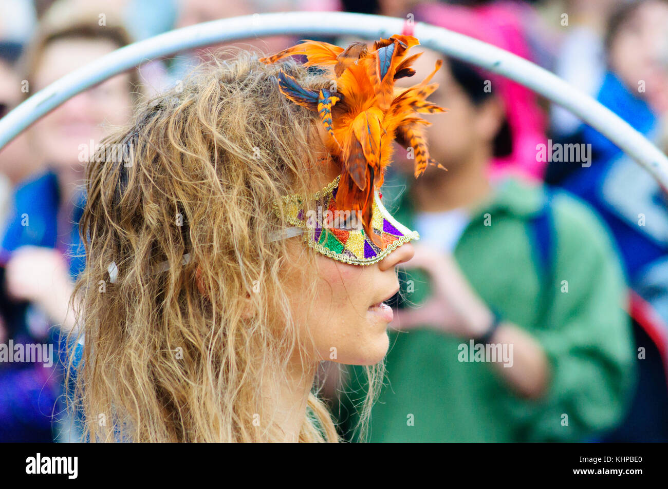 Female member of The Hula Honeys wearing a mask & performing in the ...