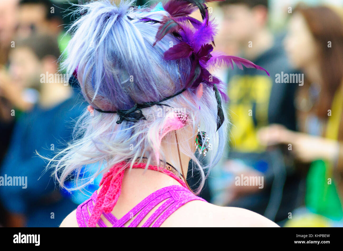 Female member of The Hula Honeys wearing a mask & performing in the ...