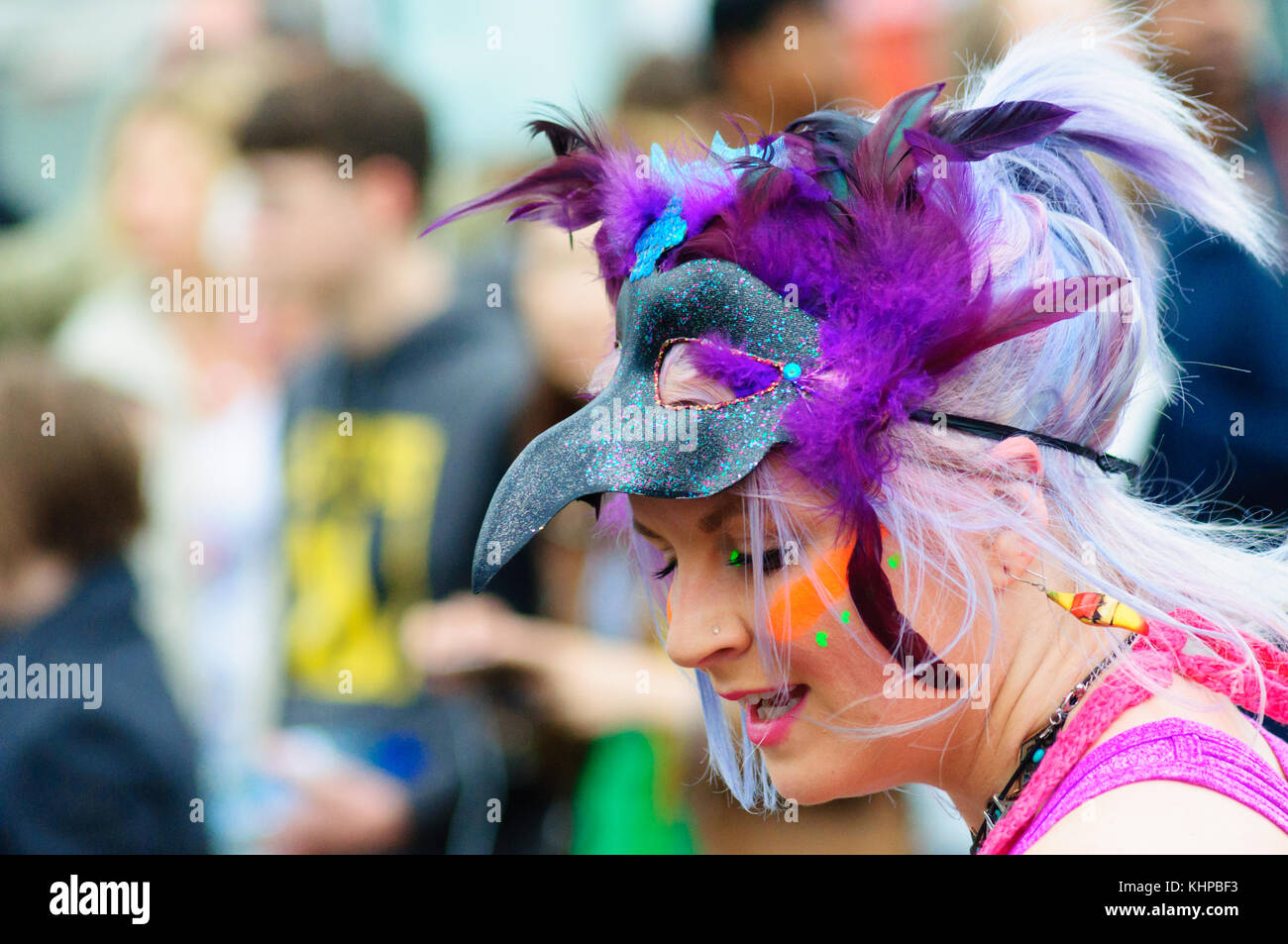 Female member of The Hula Honeys wearing a mask & performing in the ...