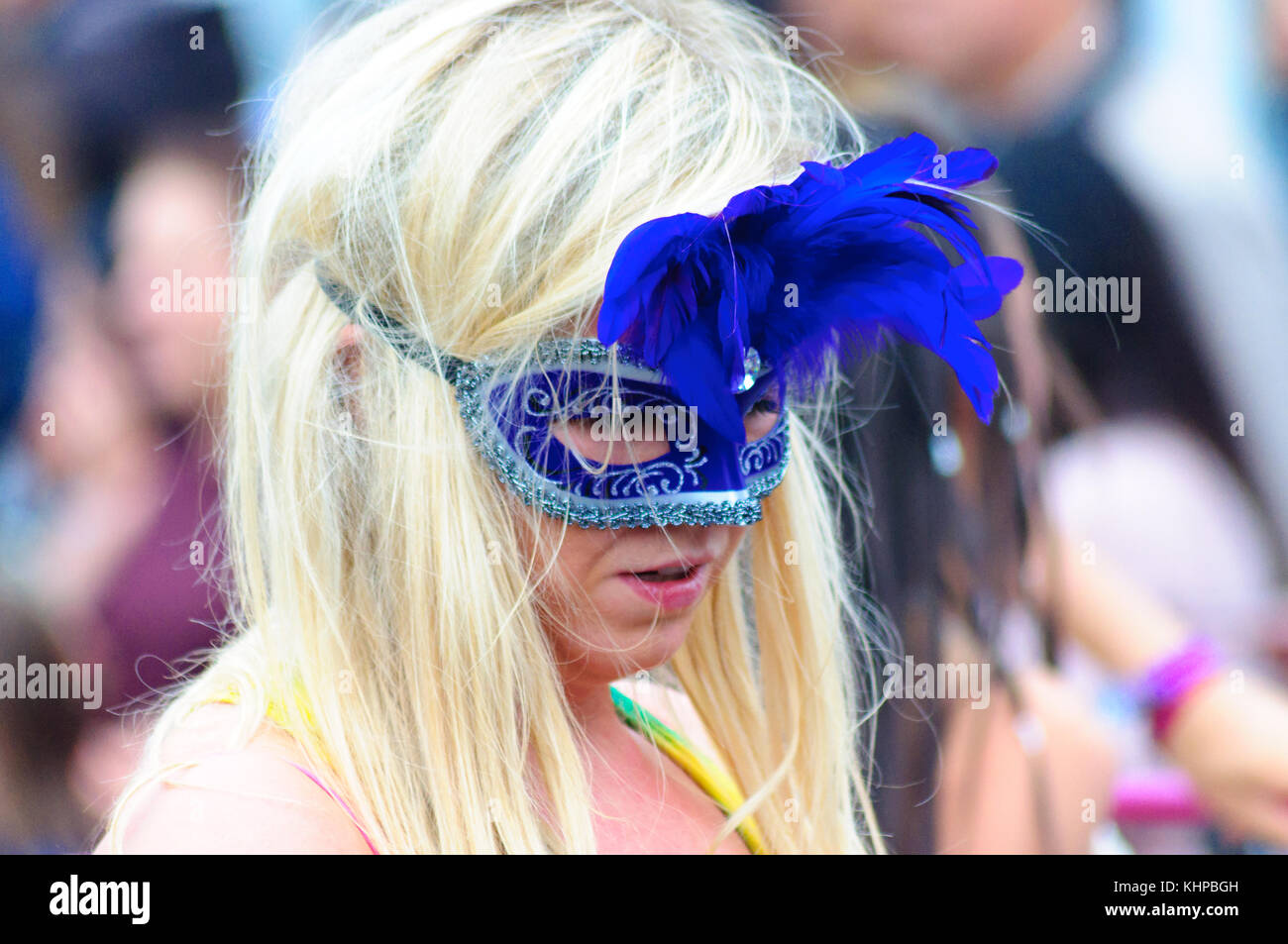 Female member of The Hula Honeys wearing a mask & performing in the ...