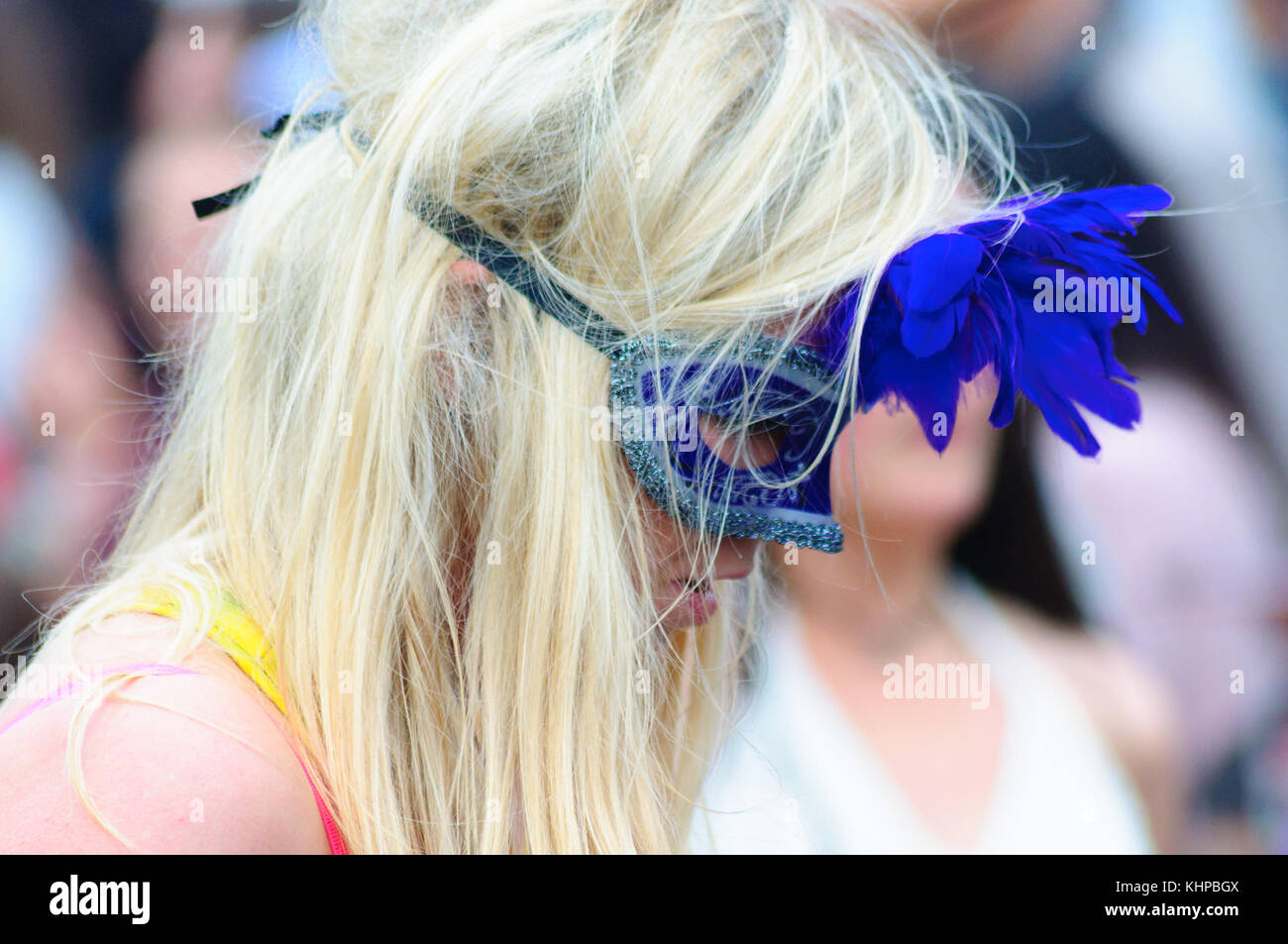 Female member of The Hula Honeys wearing a mask & performing in the ...