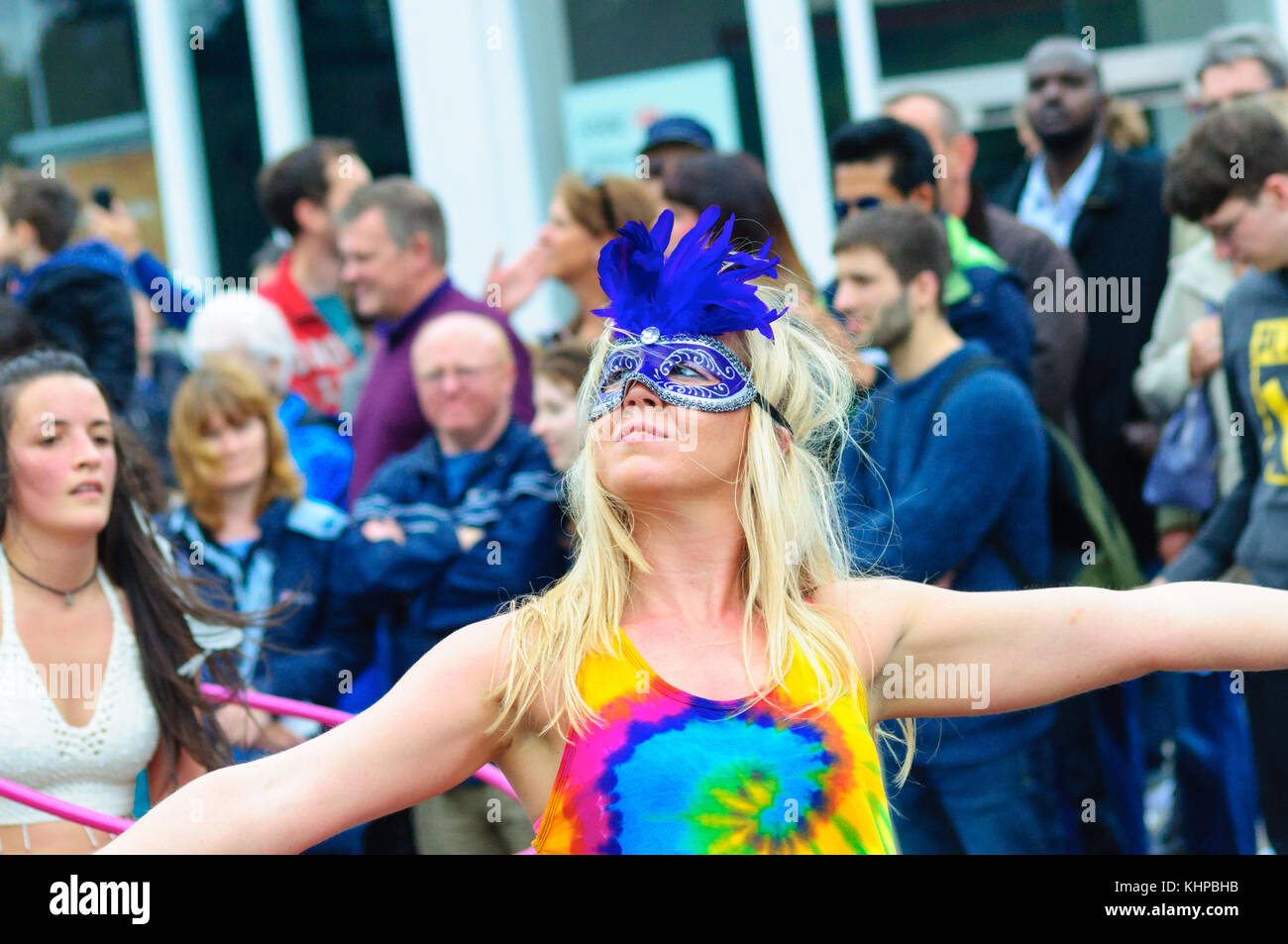 Female member of The Hula Honeys wearing a mask & performing in the ...