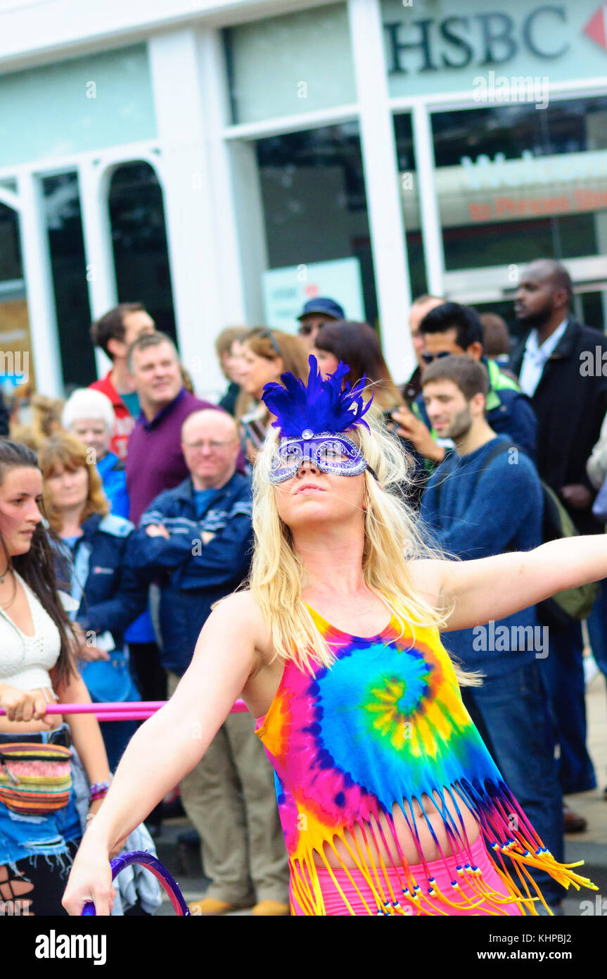 Female member of The Hula Honeys wearing a mask & performing in the ...
