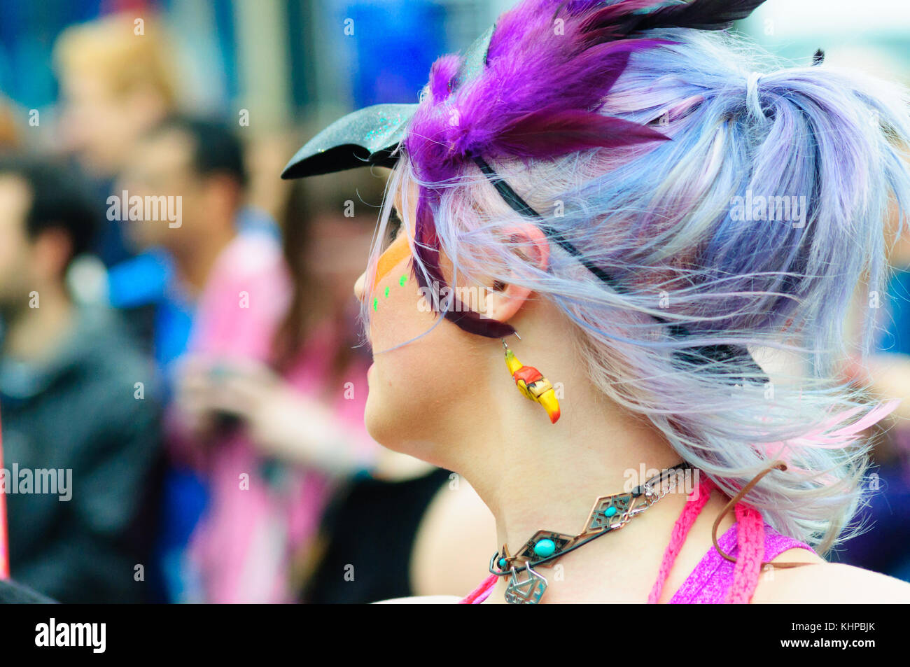 Female member of The Hula Honeys wearing a mask & performing in the ...