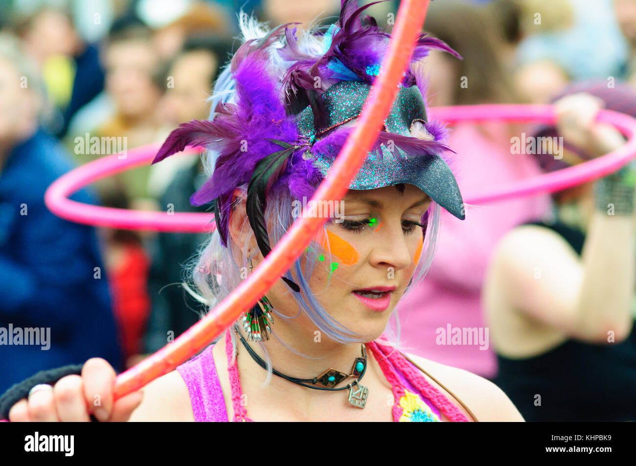 Female member of The Hula Honeys wearing a mask & performing in the ...