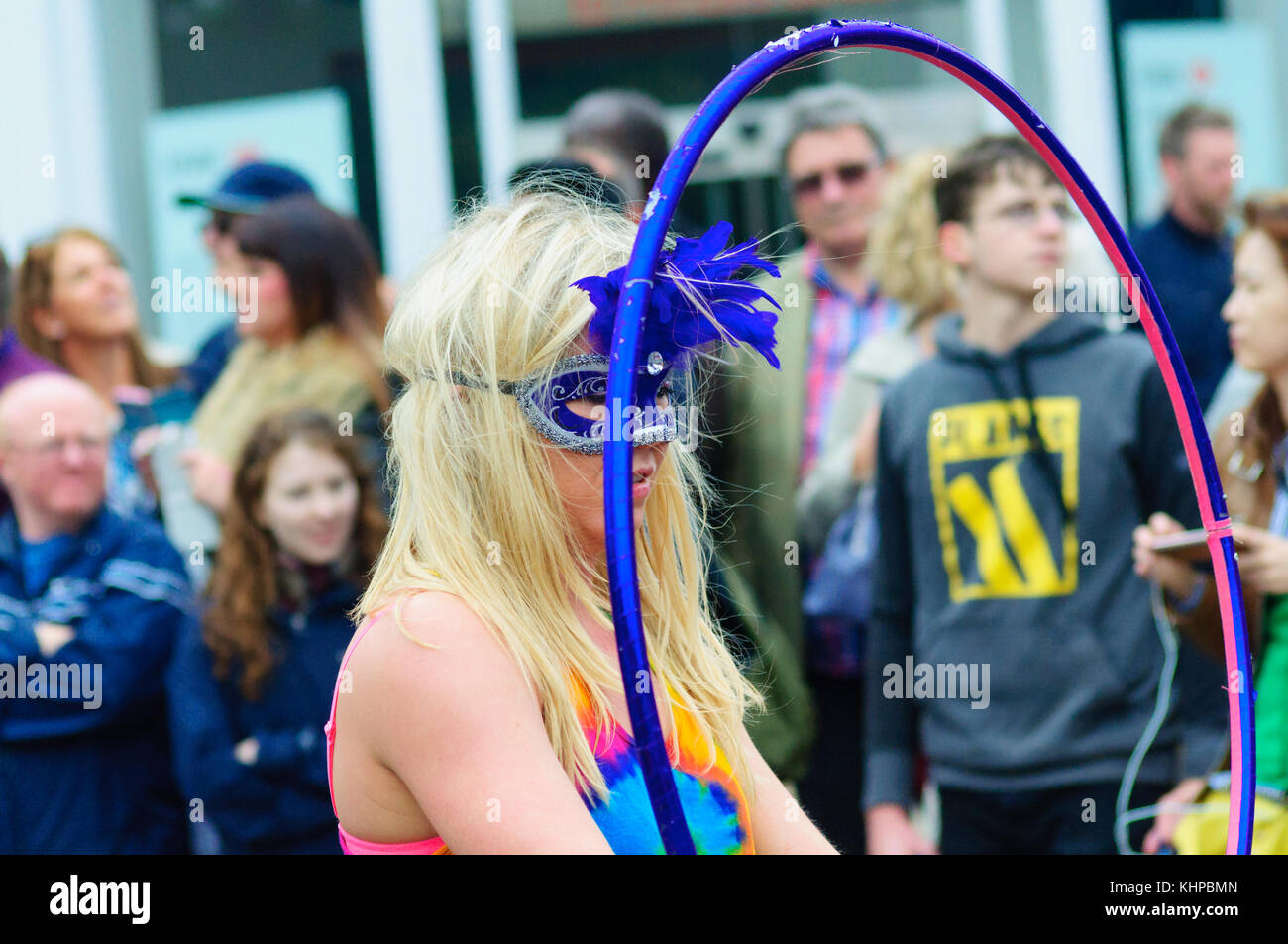 Female member of The Hula Honeys wearing a mask & performing in the ...