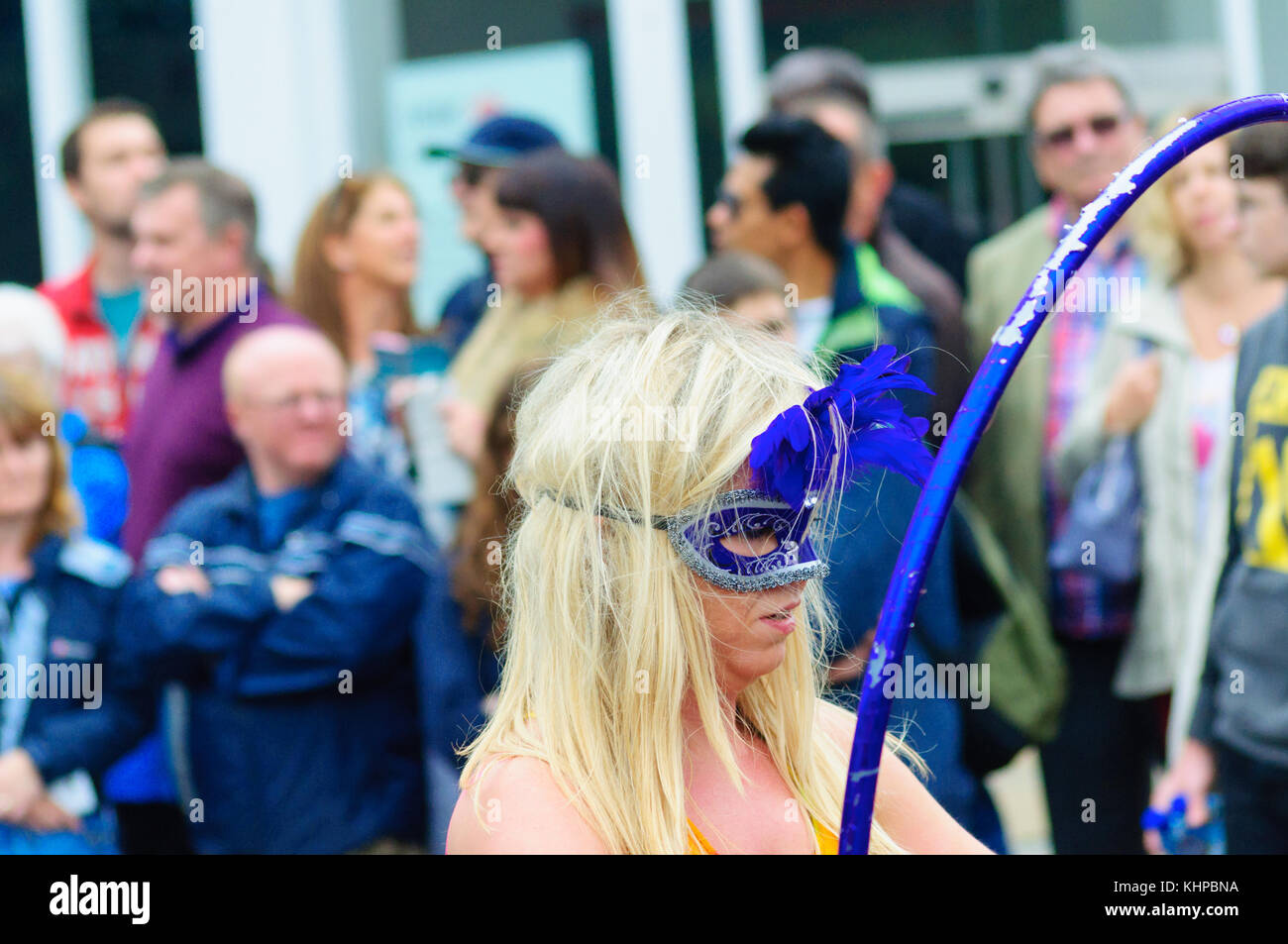 Female member of The Hula Honeys wearing a mask & performing in the ...