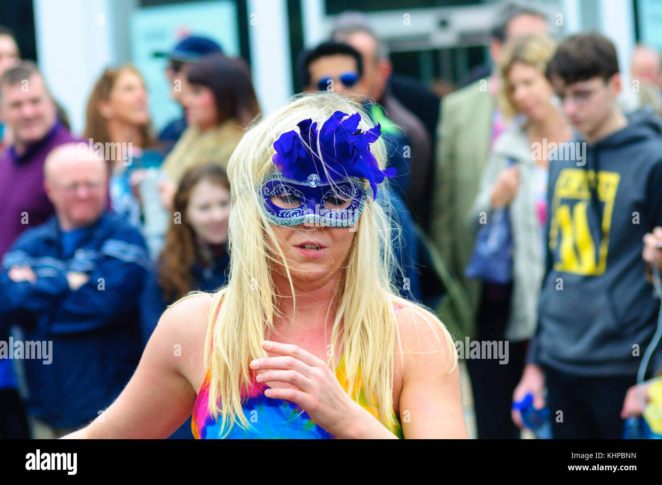 Female member of The Hula Honeys wearing a mask & performing in the ...