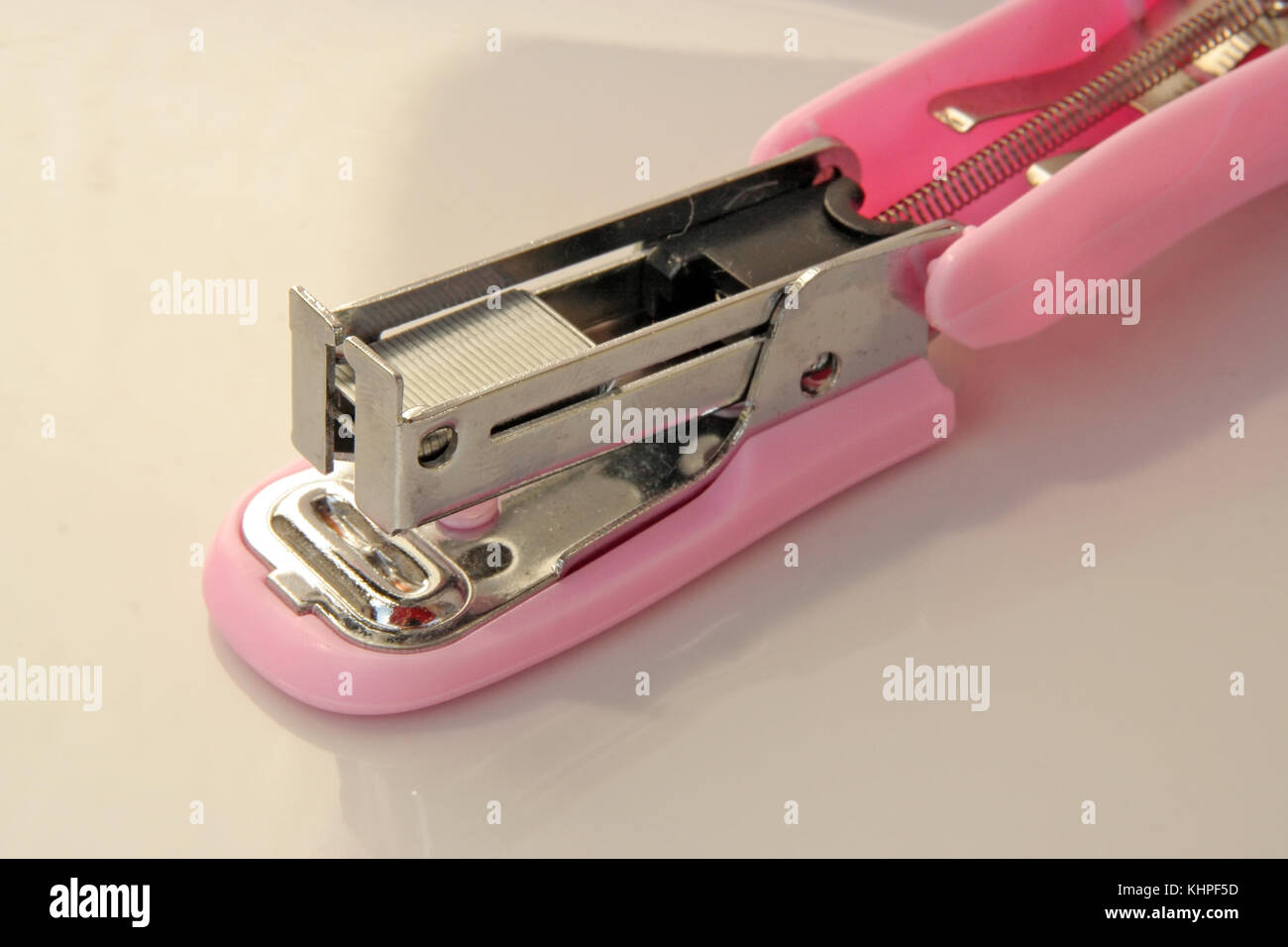 Pink stapler tool. Pink office tool Stock Photo - Alamy